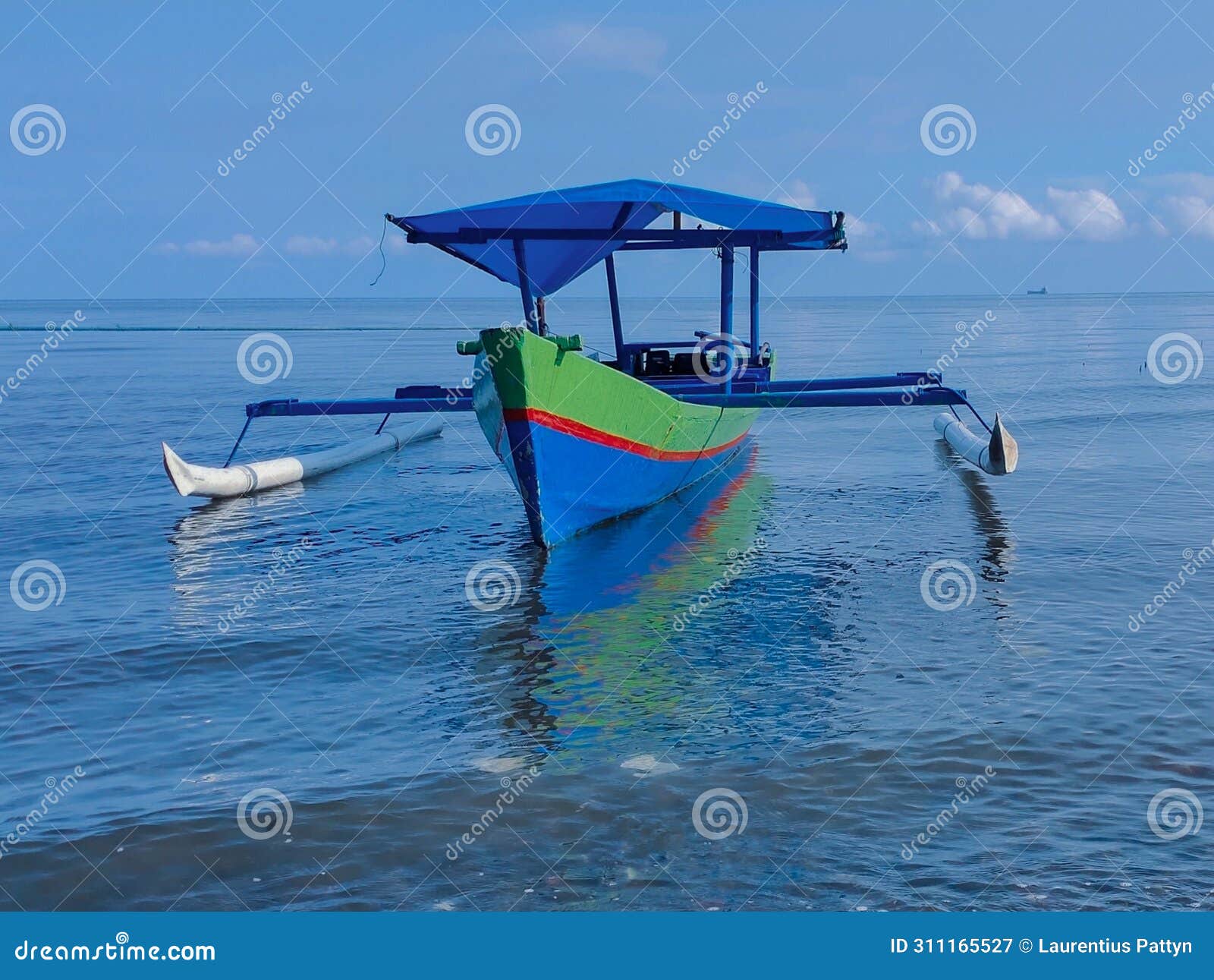 Traditional Outrigger Boat with a Tranquil Scene on Morowali Beach ...
