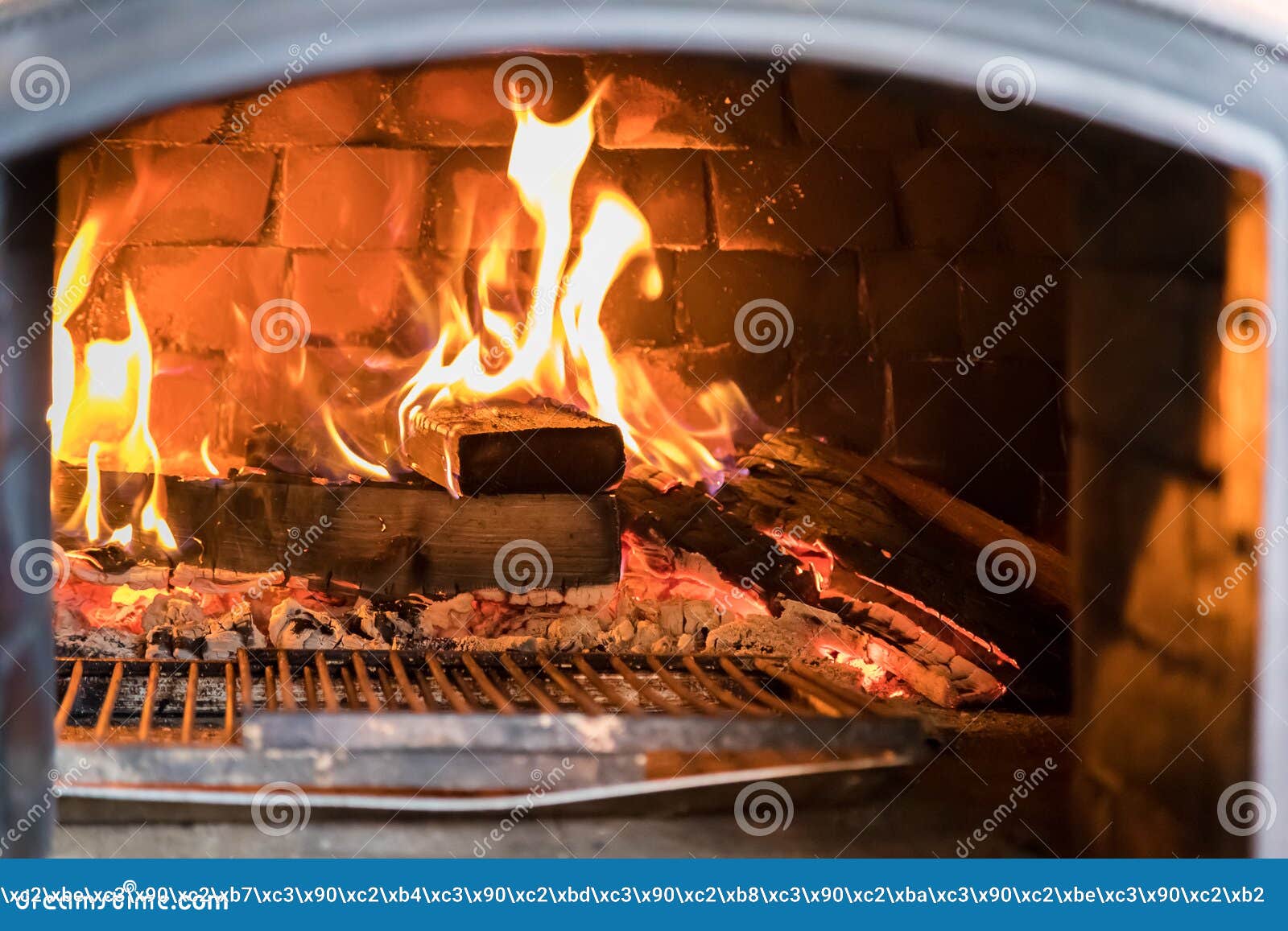 Cooking With Firewood In An Outdoor Countryside Oven. Royalty-Free ...