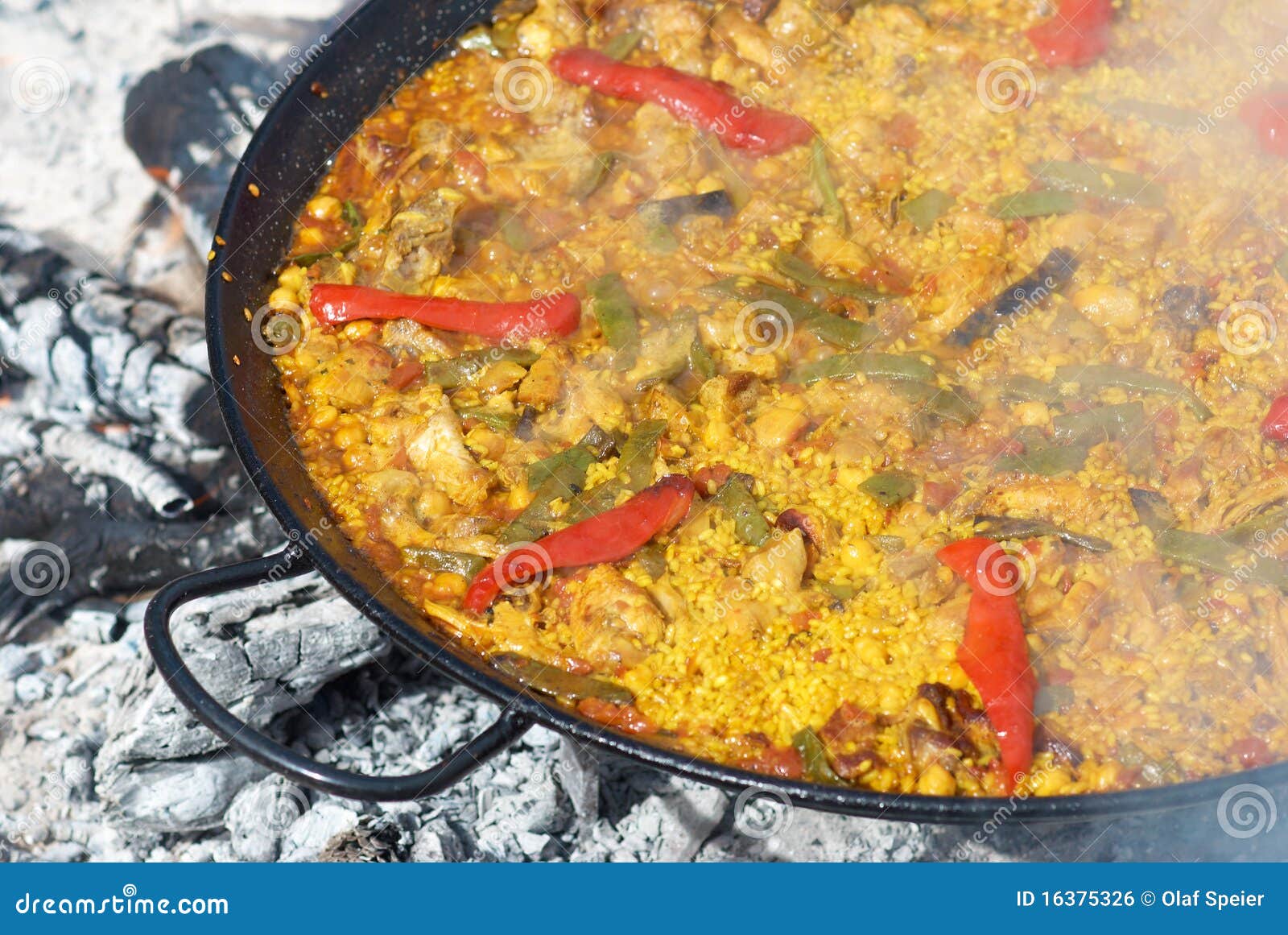 Traditional paella cooking stock photo. Image of meat - 16375326