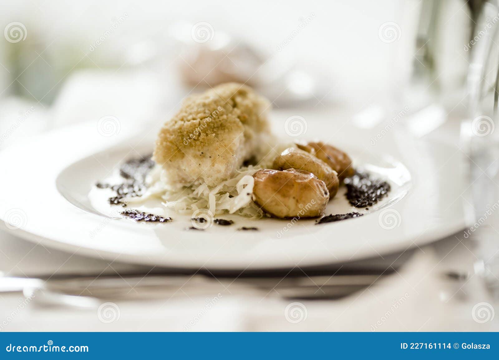 Traditional Portuguese Baked Cod Served with Baked Potato Stock Photo ...