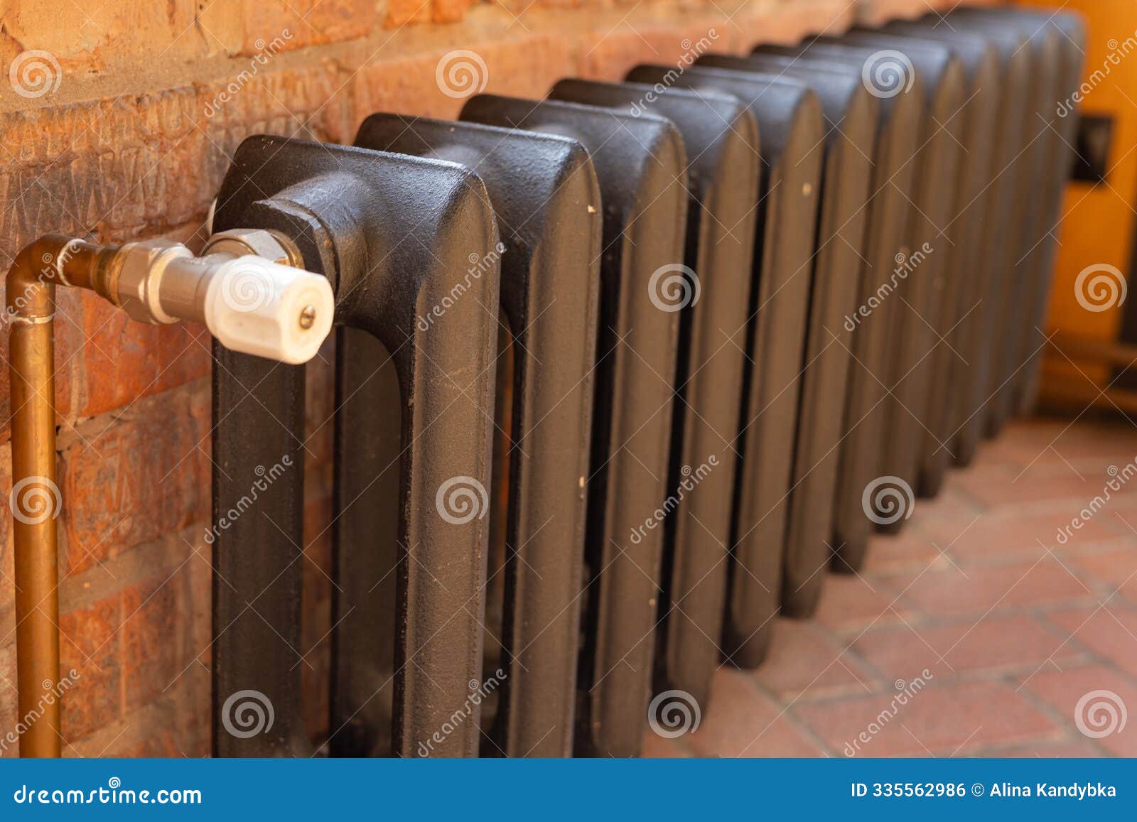Classic Metallic Radiator Installed in a Cozy Indoor Space with Exposed ...