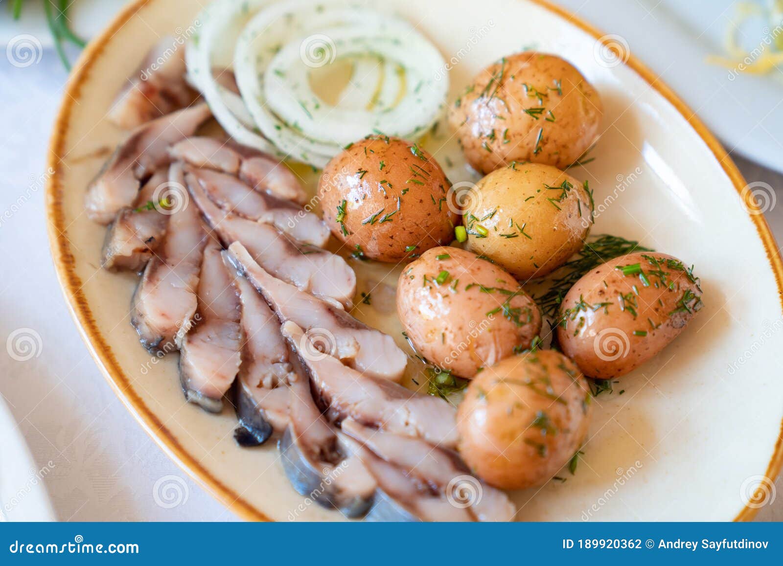 Russian Appetizer of Potato Skins and Pickled Herring Stock Photo ...