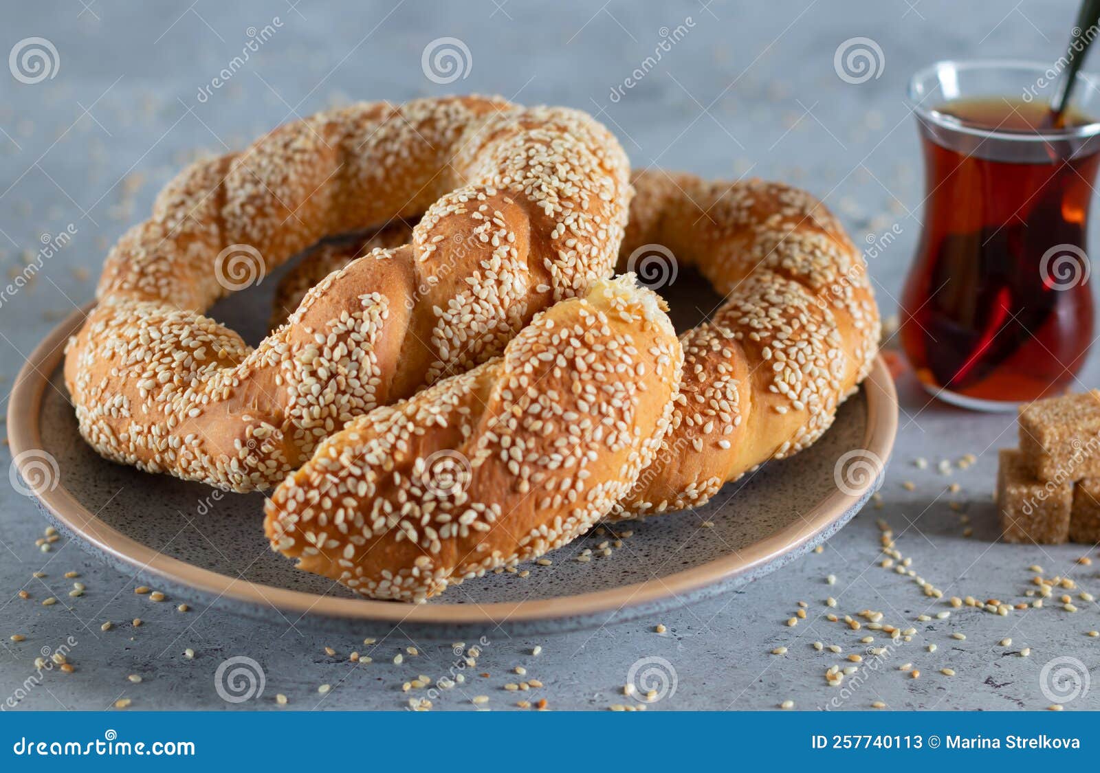 Traditional Turkish Simits with Cane Sugar on Light Concrete Background ...