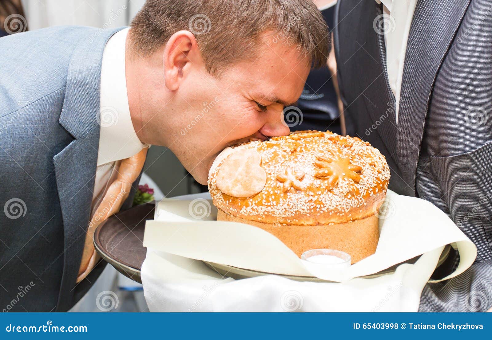 Traditional Wedding Custom To Bite a Large Piece Stock Photo - Image of ...