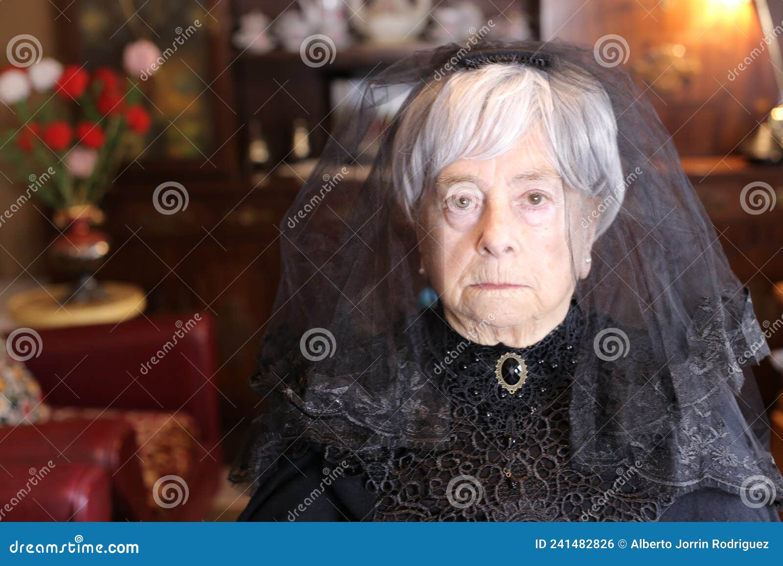 Traditionally Dressed Senior Widow with Sad Expression Stock Photo ...