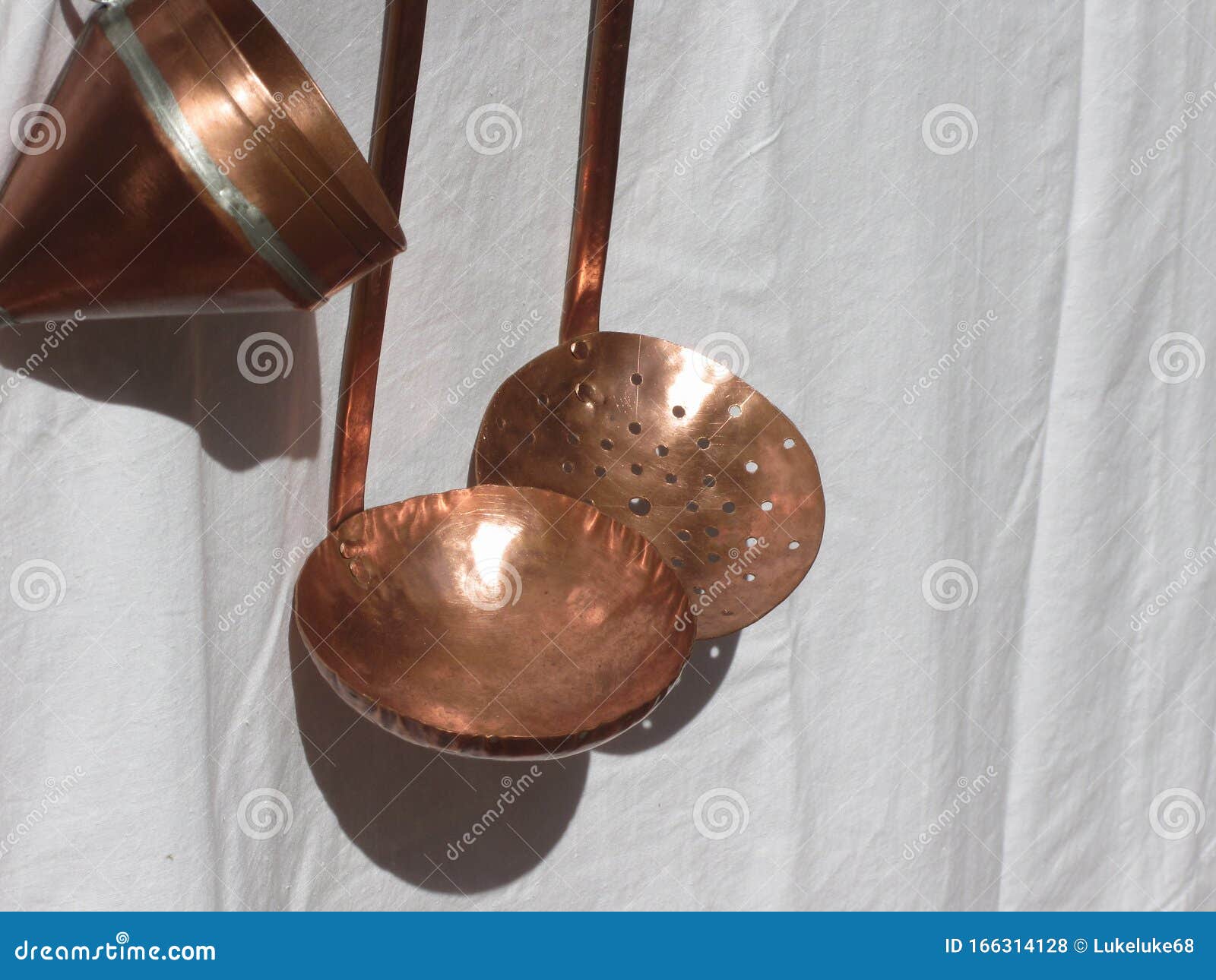 Traditionally Handcrafted Copper Kitchen Utensils Against White ...