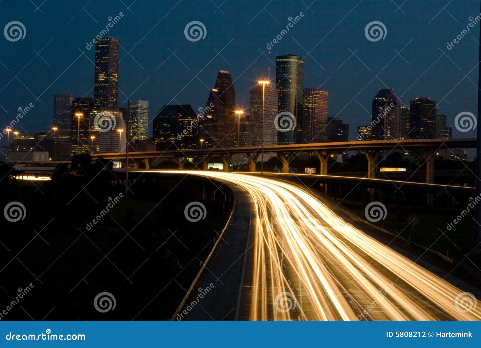 Traffic and the City Skyline at Night Stock Photo - Image of green ...