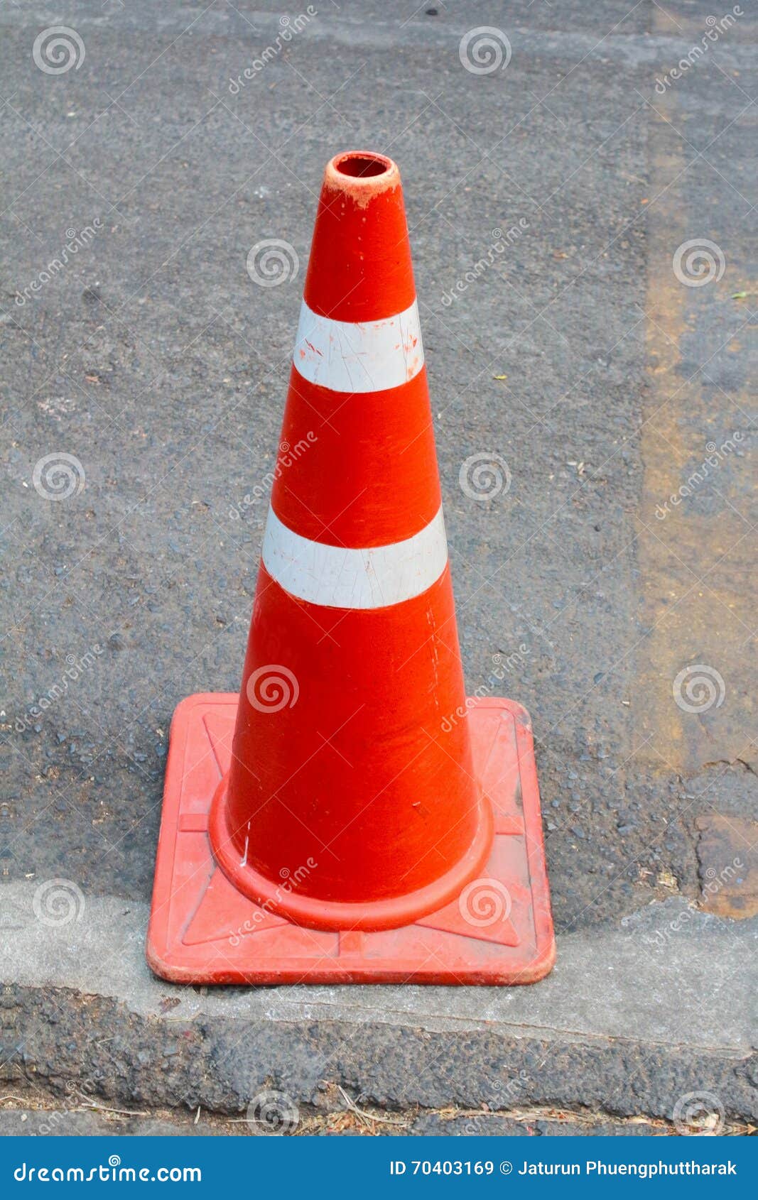 The traffic cone on a road stock image. Image of single - 70403169
