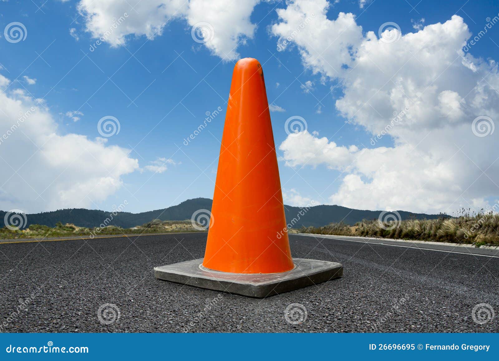 Traffic Cone on a Road with a Bright Blue Sky Stock Image - Image of ...