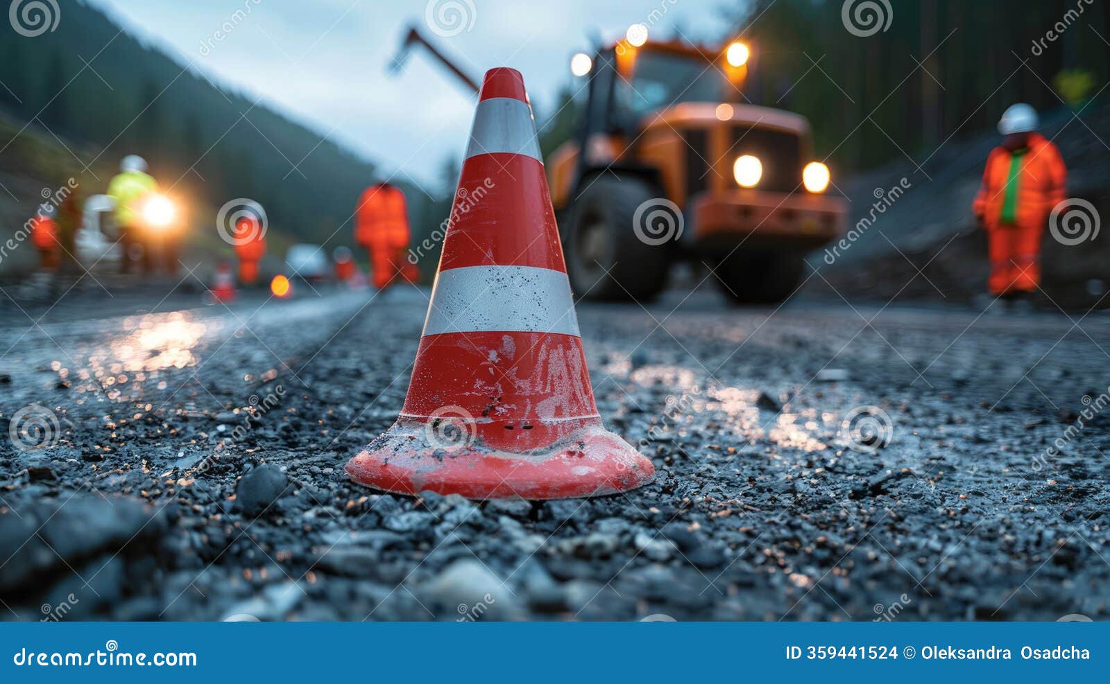 Traffic Cone on a Road with Construction Workers in the Background ...