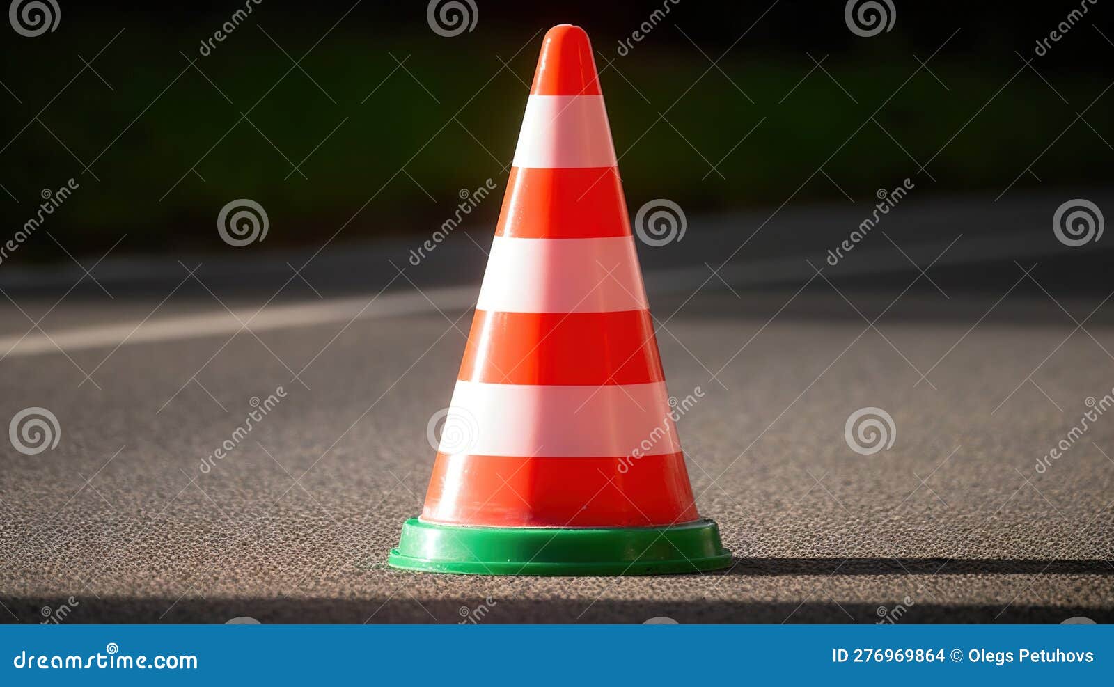 A Traffic Cone Sitting on the Side of a Road Next To a Road Stock Photo ...