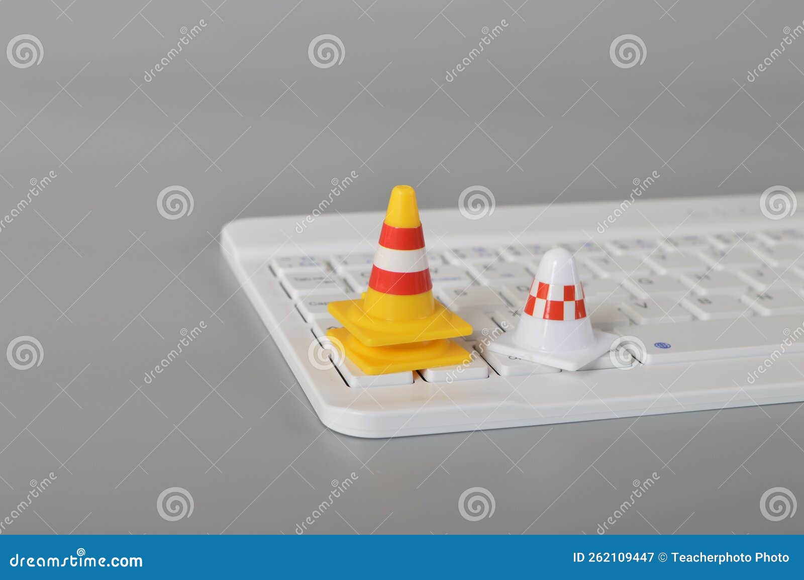 Traffic Cones and Laptop Keyboard.Computer System Under Construction ...