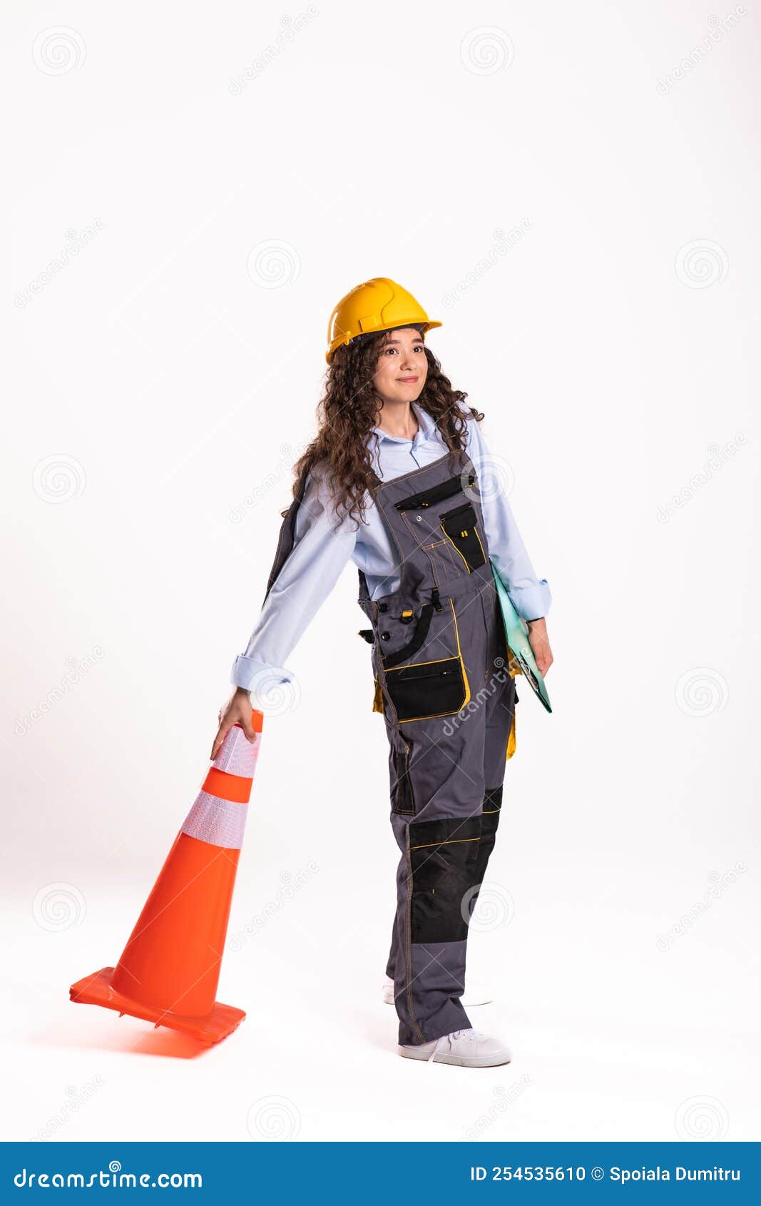 A Traffic Controller Carrying a Pylon Stock Photo - Image of controller ...