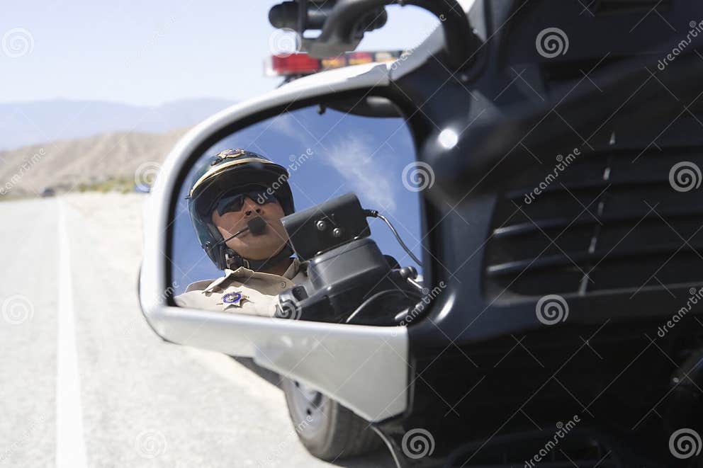 Traffic Cop Reflecting in Side View Mirror Stock Photo - Image of ...