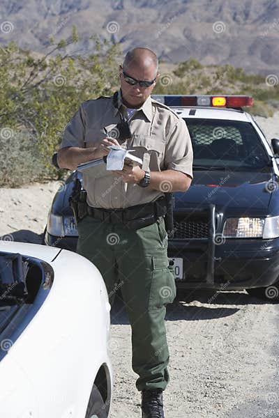 Traffic Cop Writing Ticket stock image. Image of caucasian - 29651447
