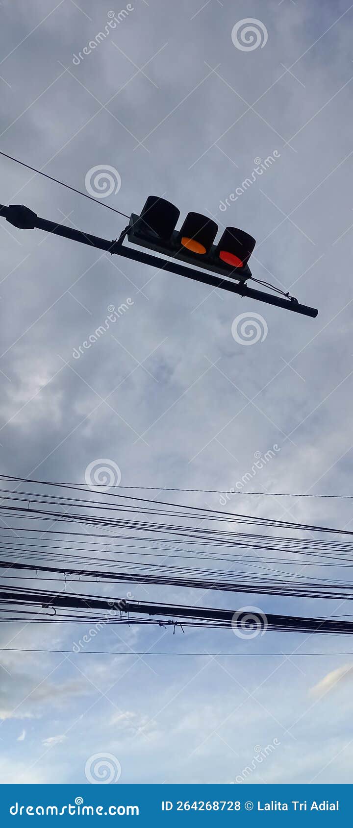 A Traffic Lamp and a Lines of Electricity String in the Sky Stock Photo ...