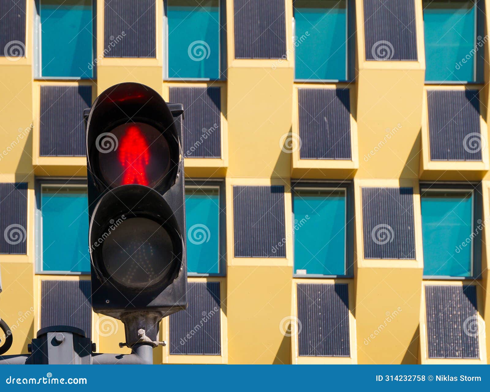 A Traffic Light in Front of a Building Stock Photo - Image of crossing ...