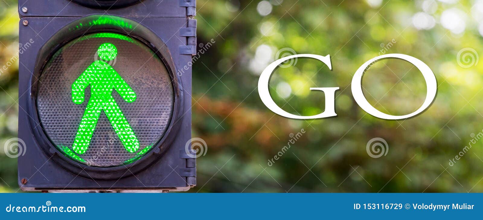 A Traffic Light with a Green Light and a Text Go_ Stock Image - Image ...