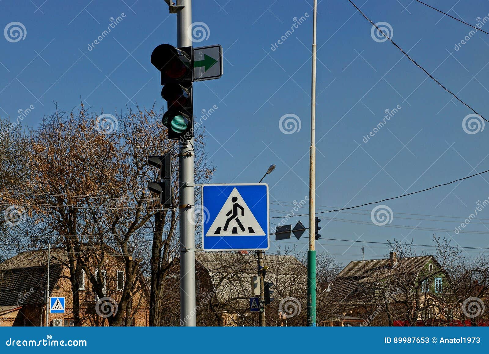 Traffic Light and Road Sign at the Intersection Stock Image - Image of ...