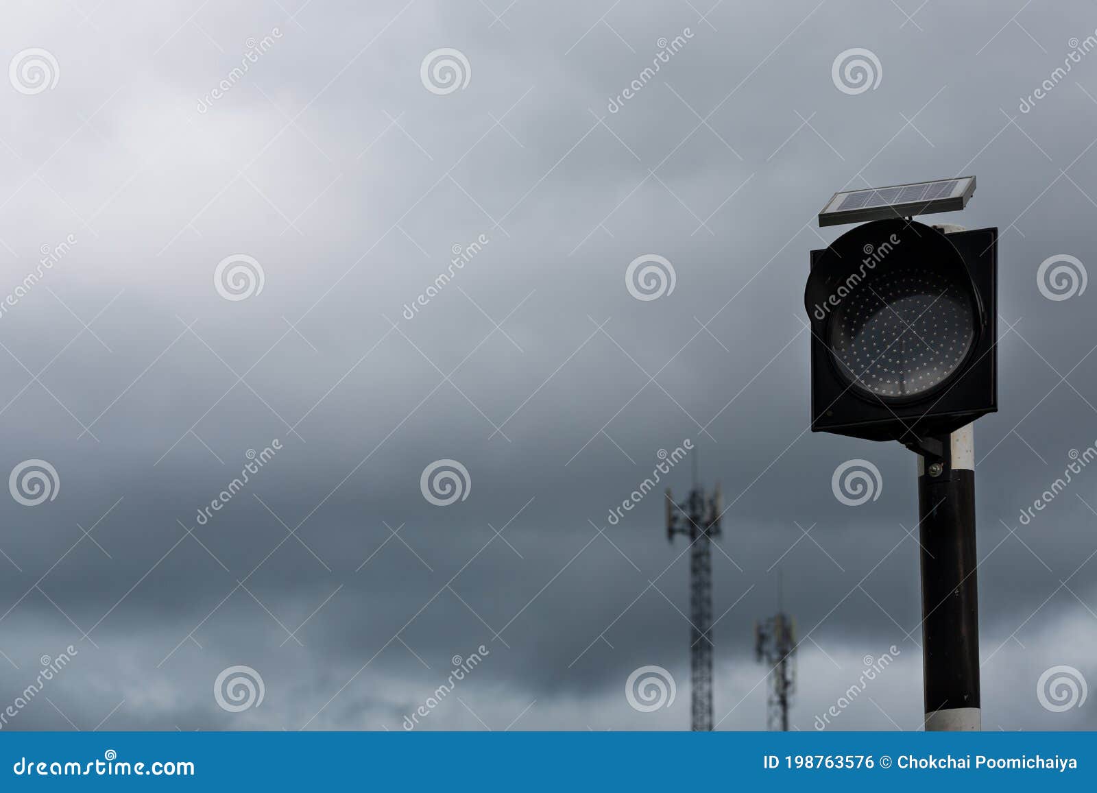 Traffic Light with Solar Cell Panel on the Top Against Stormy Cloud ...