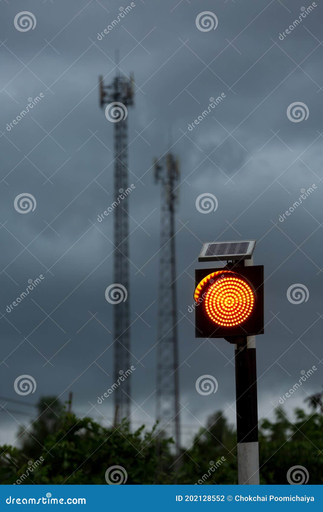 Traffic Light with Solar Cell Panel on the Top Against Stormy Cloud ...