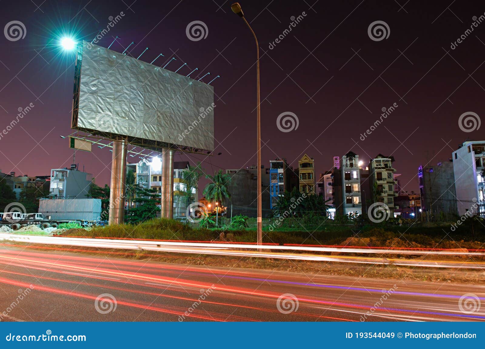 Traffic Light Trails Below Billboard on Road Stock Image - Image of ...