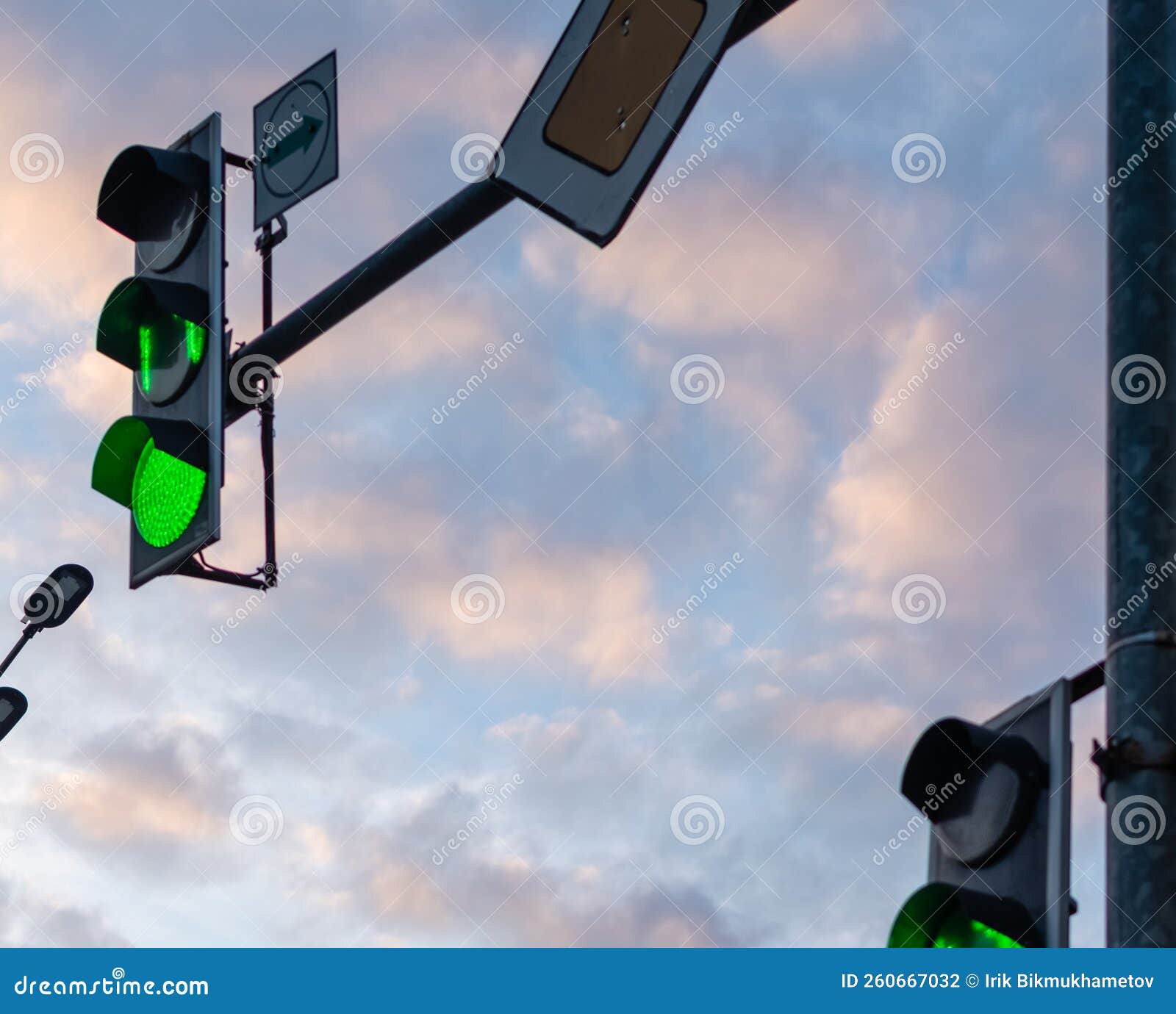 Traffic Lights with Green Color Background of Clouds Stock Photo ...