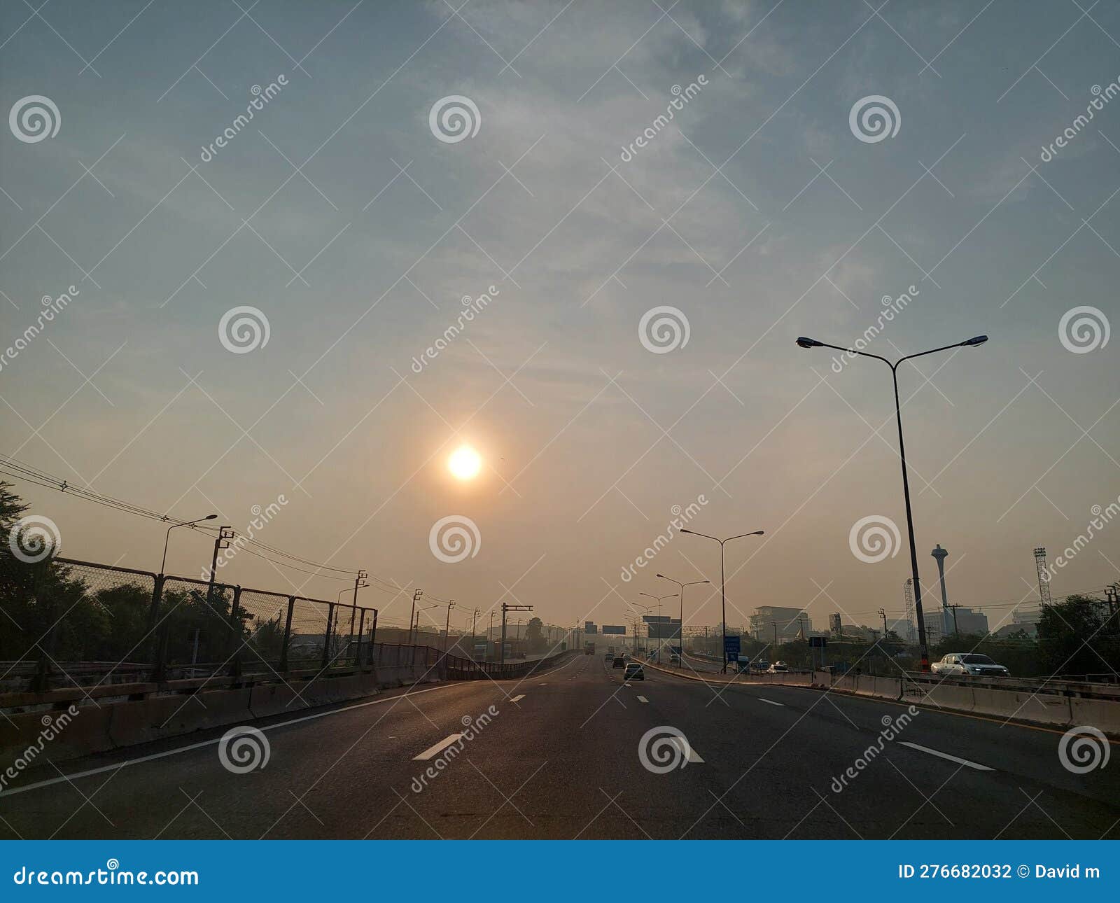 Car Lights On The Highway With Stop Sign On The Edge Of The Road Stock ...