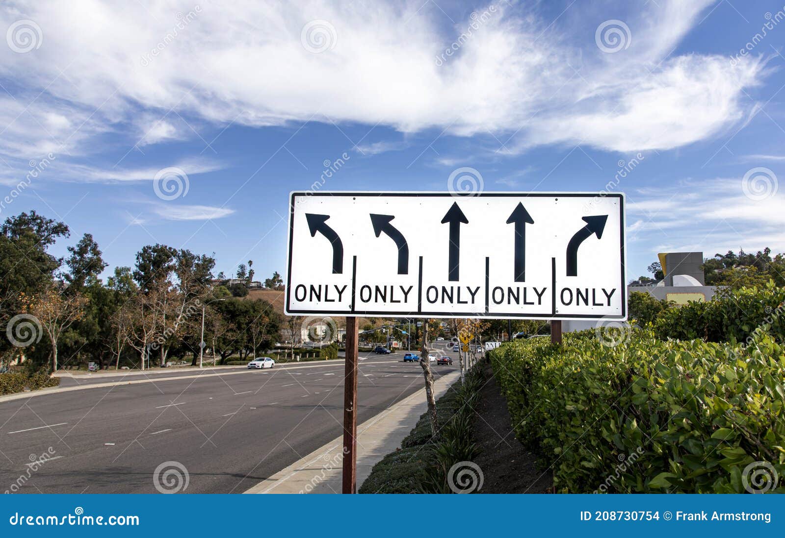 Traffic Sign with Five Arrows for Different Directions Against a Blue ...