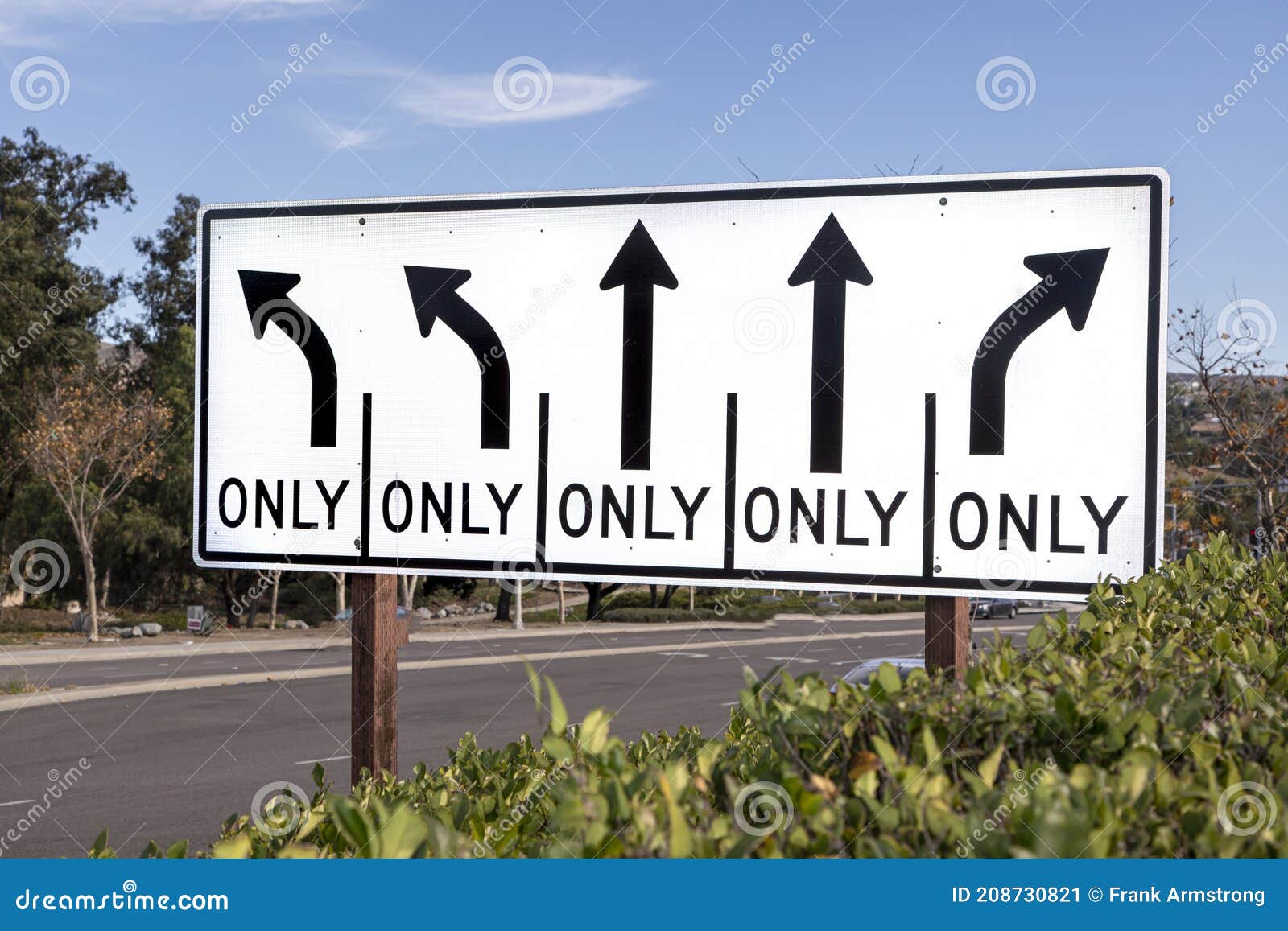 Traffic Sign with Five Arrows for Different Directions Against a Blue ...