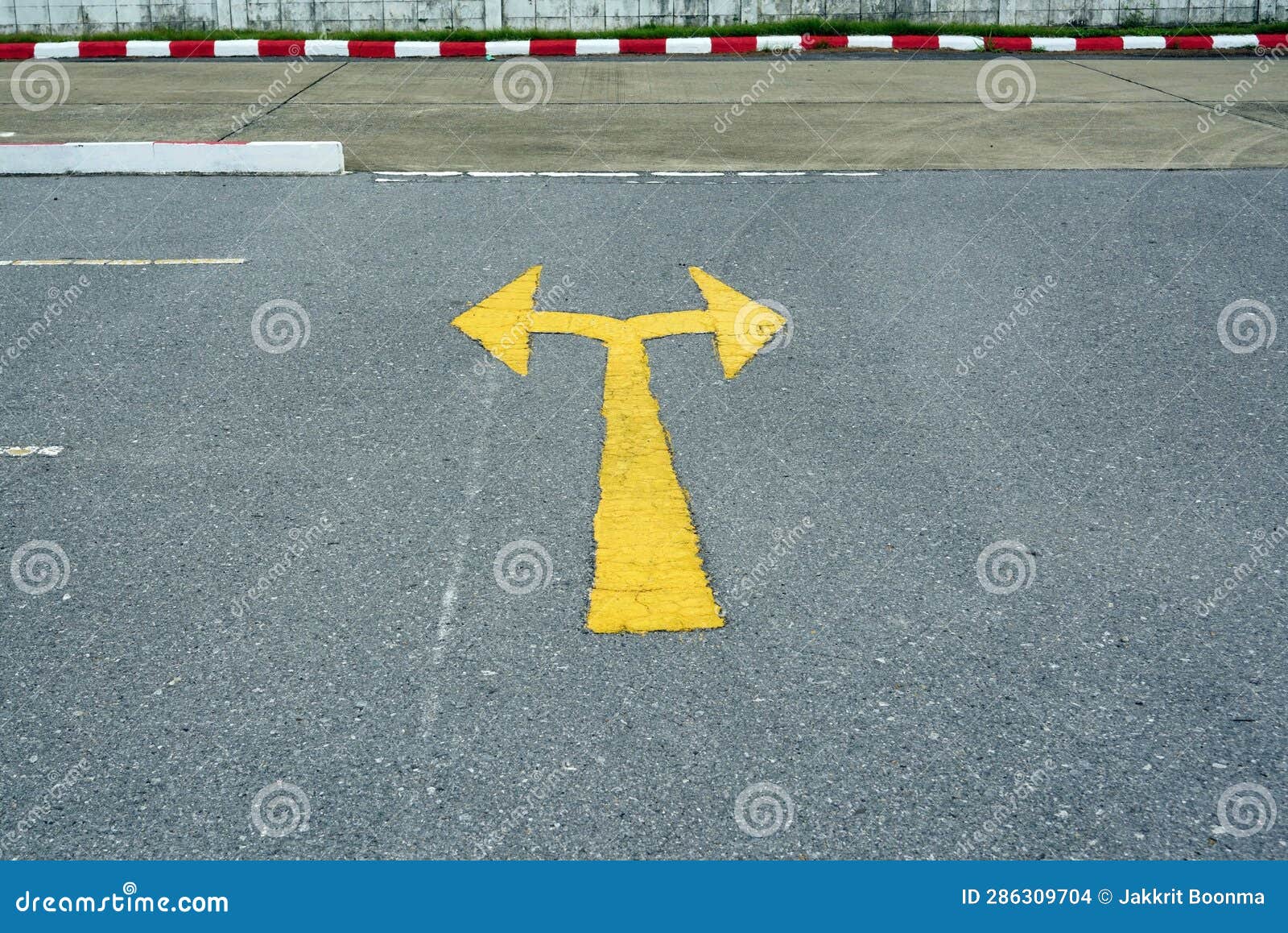 A Traffic Sign on the Road a Yellow Arrow on the Road, Traffic Concept ...