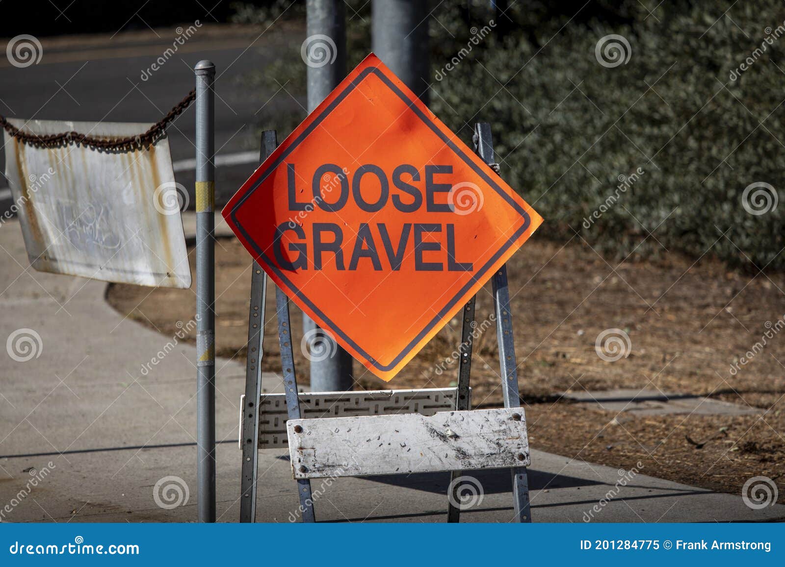 A Traffic Sign Stating Loose Gravel Stock Image - Image of caution ...