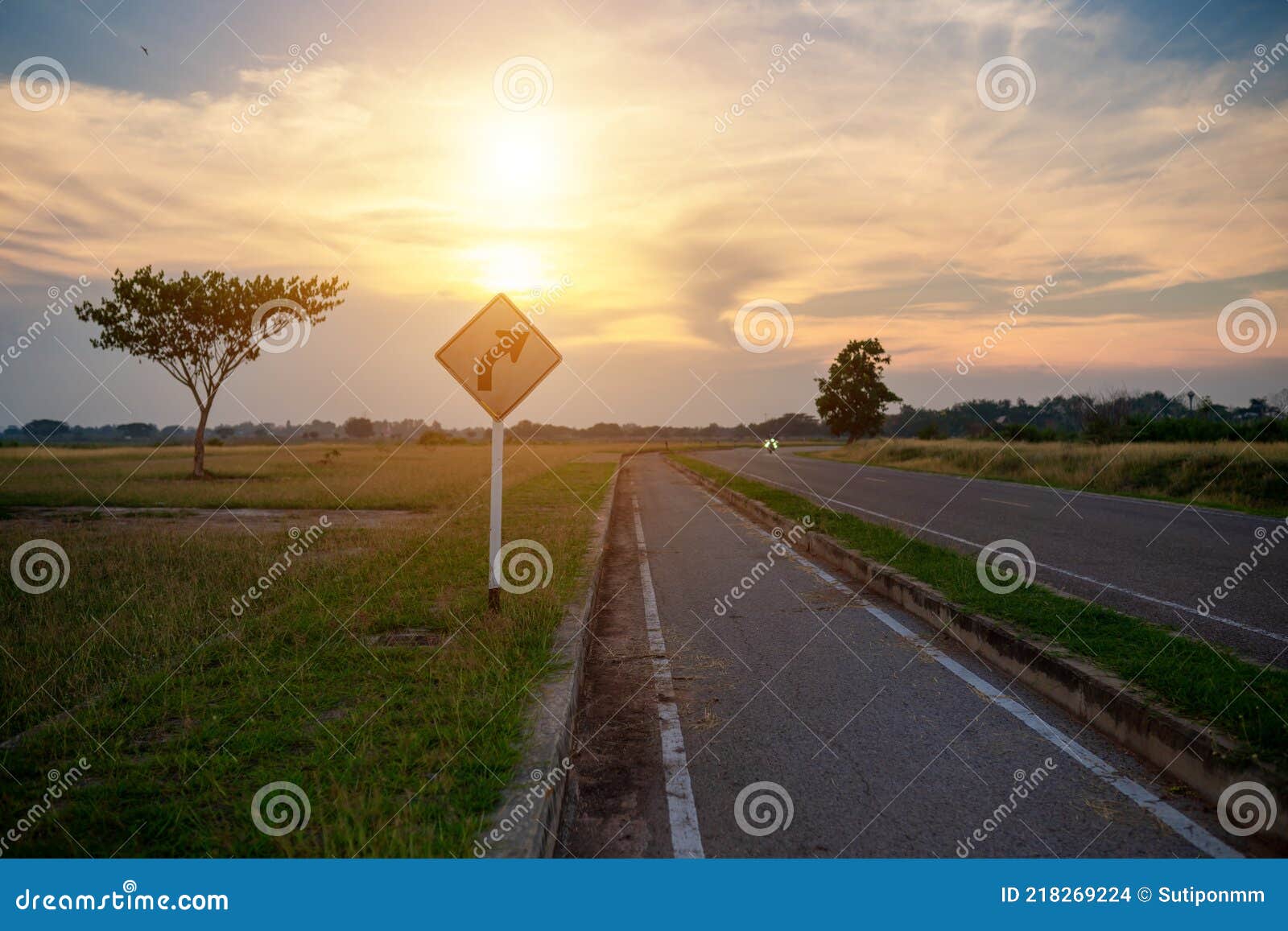 The Traffic Signs and Bike Paths during the Sunset Stock Photo - Image ...