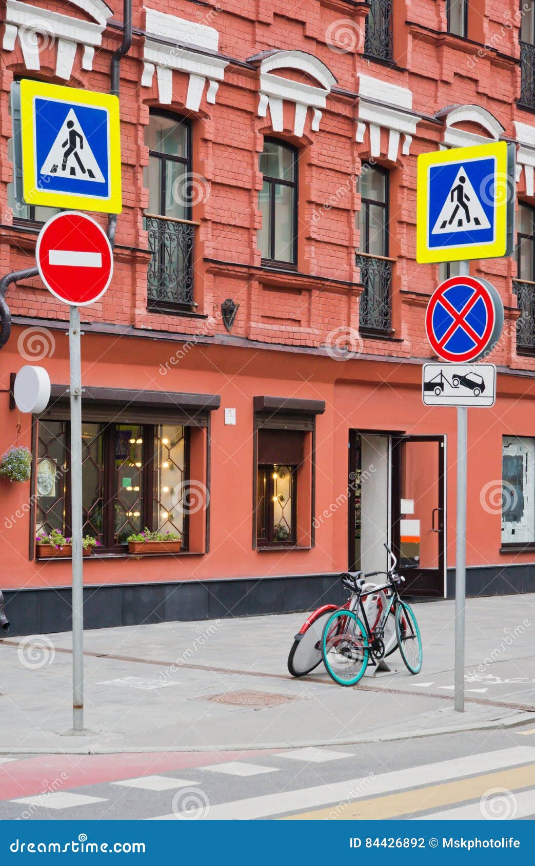 Traffic Signs Next To Brick Building Editorial Photography - Image of ...