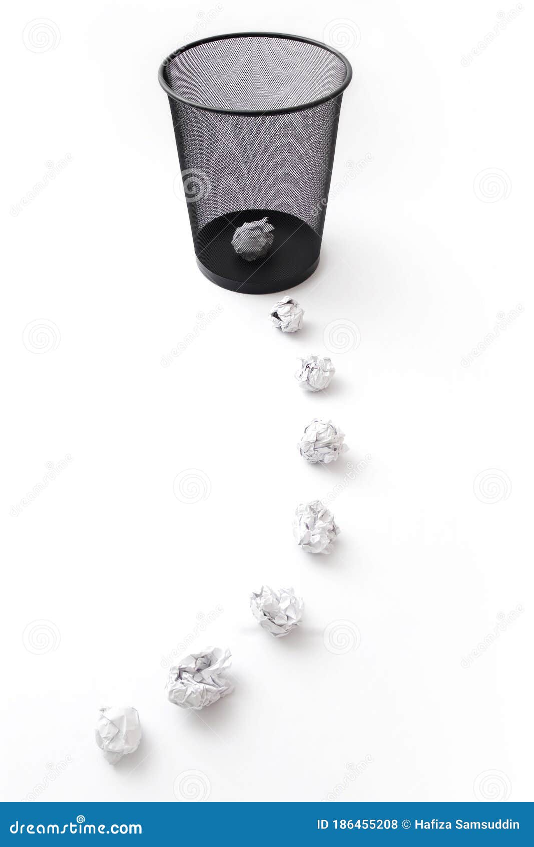 A Trail of Crumpled Papers Leading To a Crumpled Paper in a Dustbin ...