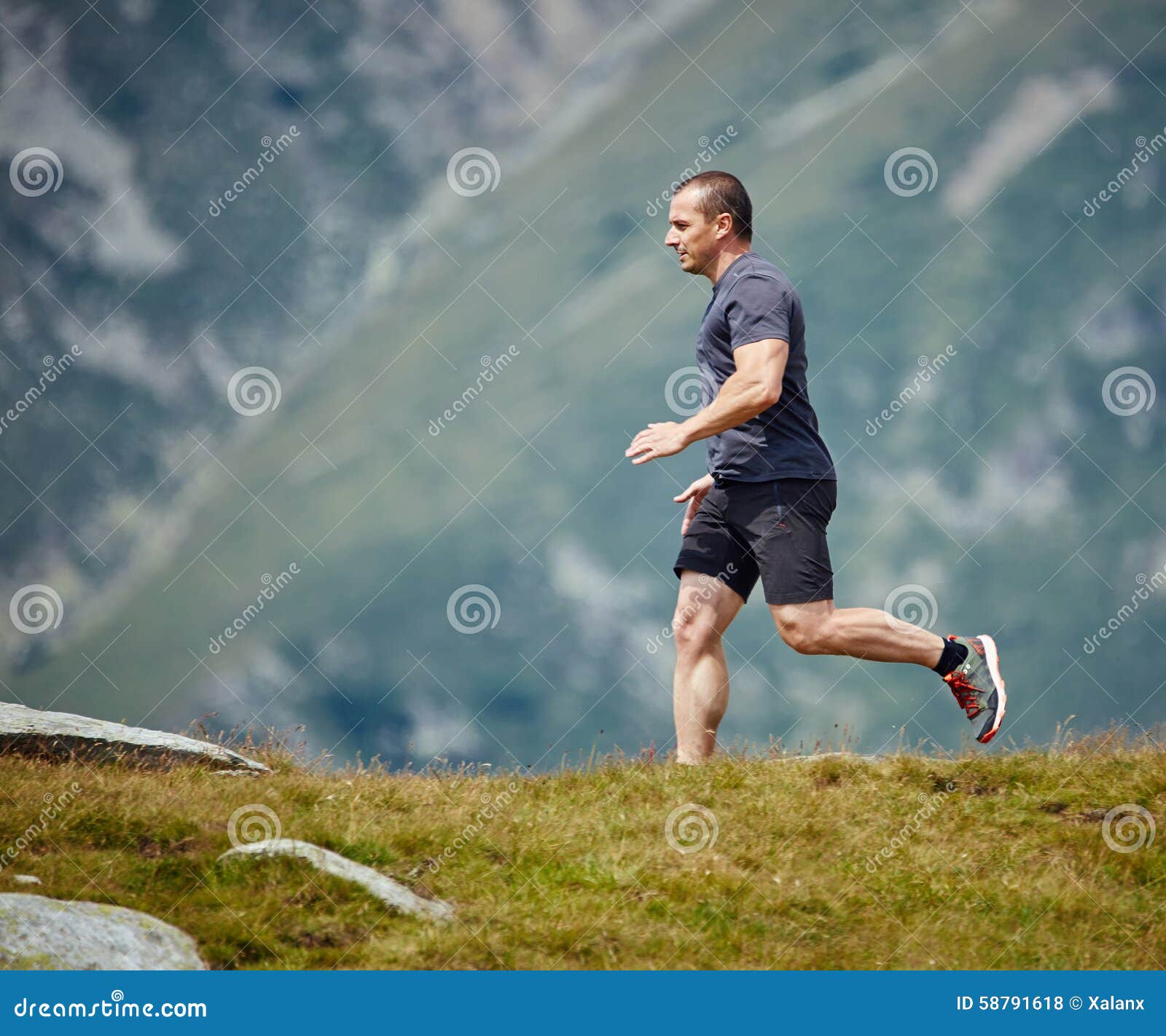 Trail Runner in the Mountains Stock Photo - Image of jogging, male ...
