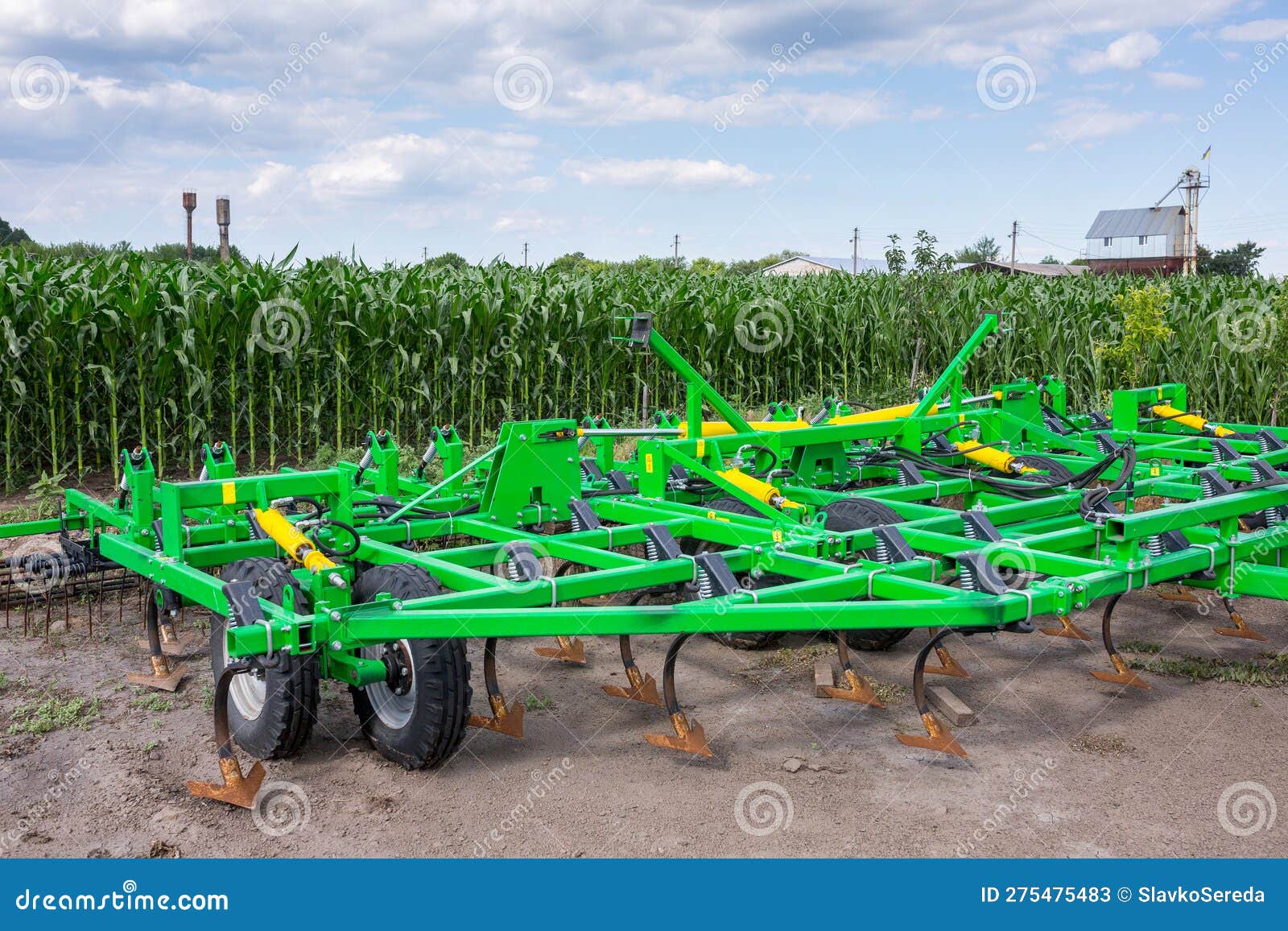 The Trailed, Five-row Cultivator with Combs and Rollers Stands on the ...