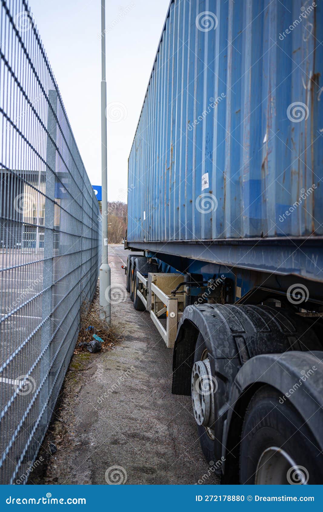 Trailer with Freight Container Parked Close To a Fence and Pole.. Stock ...