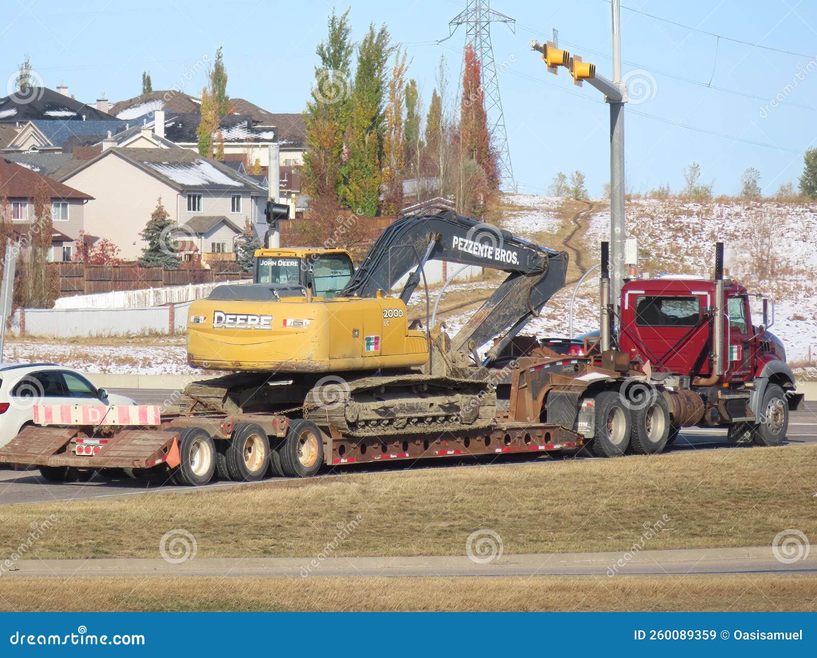 A Trailer Transporting a Deere 200D LC Excavator. Editorial Stock Image ...