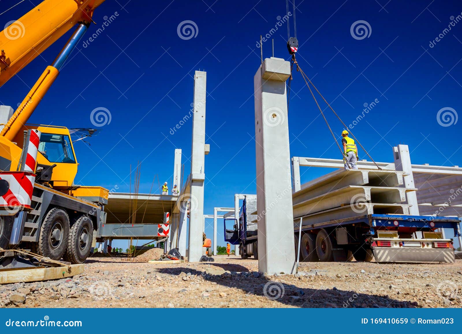 Unloading Concrete Pillar from Truck Trailer at Construction Site Stock ...