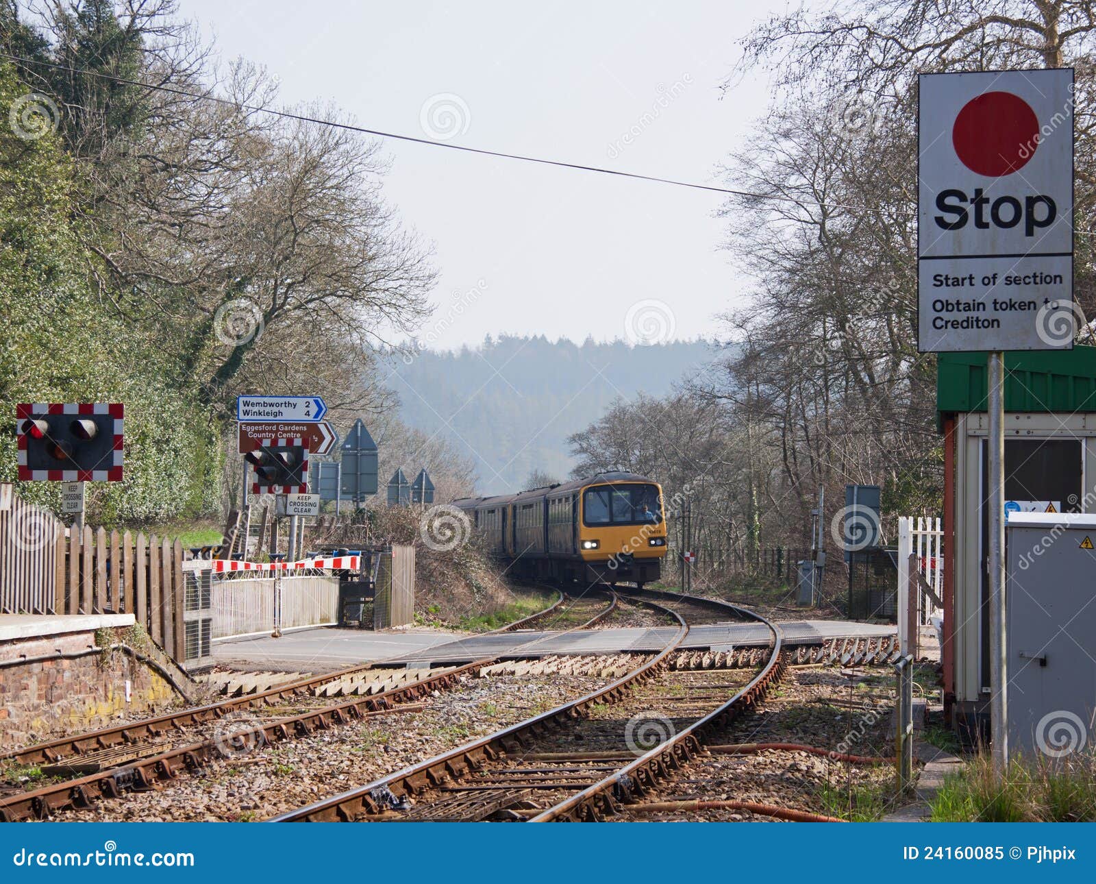 Train Approaching a Level Crossing in Devon UK Editorial Image - Image ...