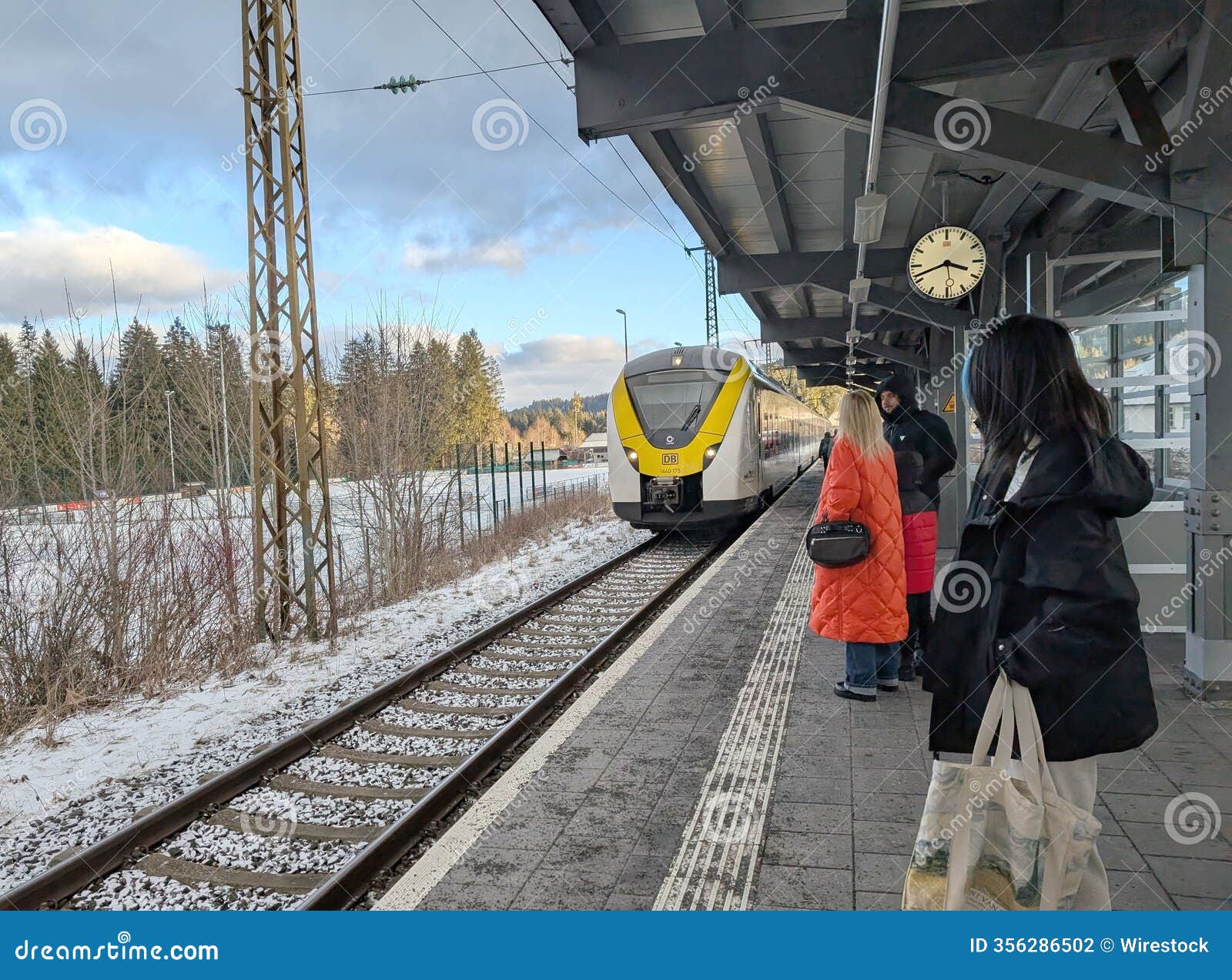 Train Arrival at Snowy Station Platform Editorial Photography - Image ...