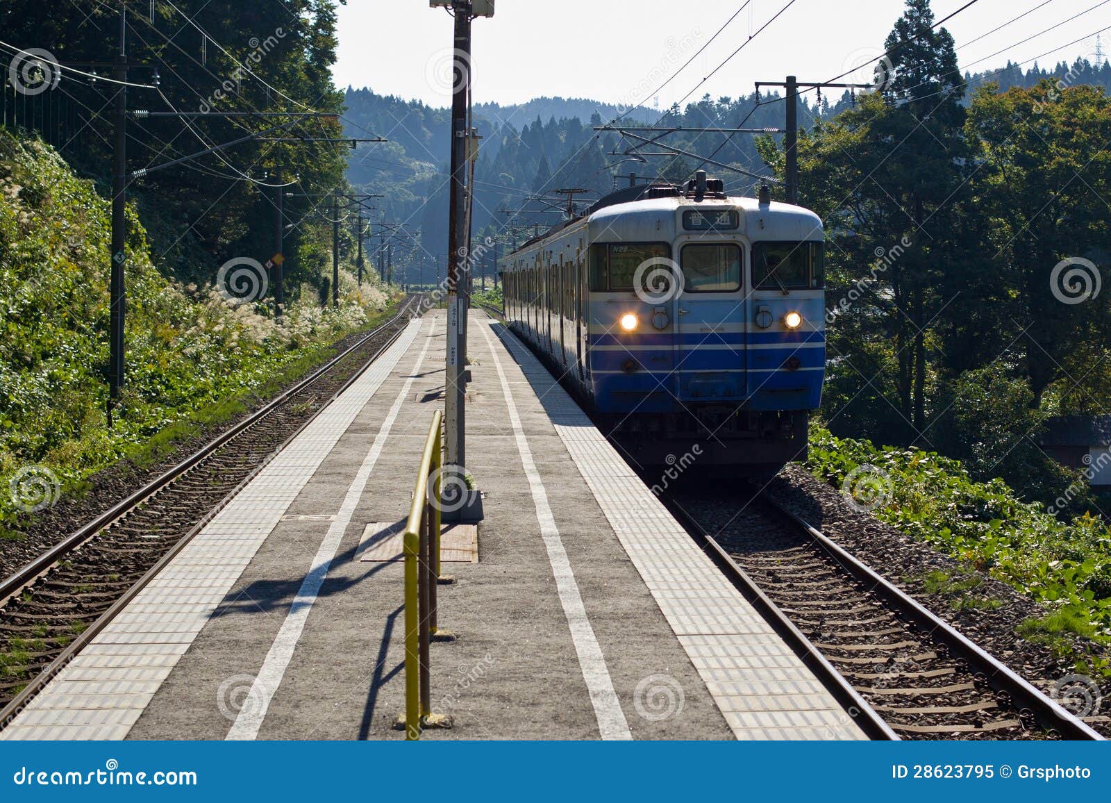 Train Arriving at Rural Japanese Station. Stock Image - Image of ...