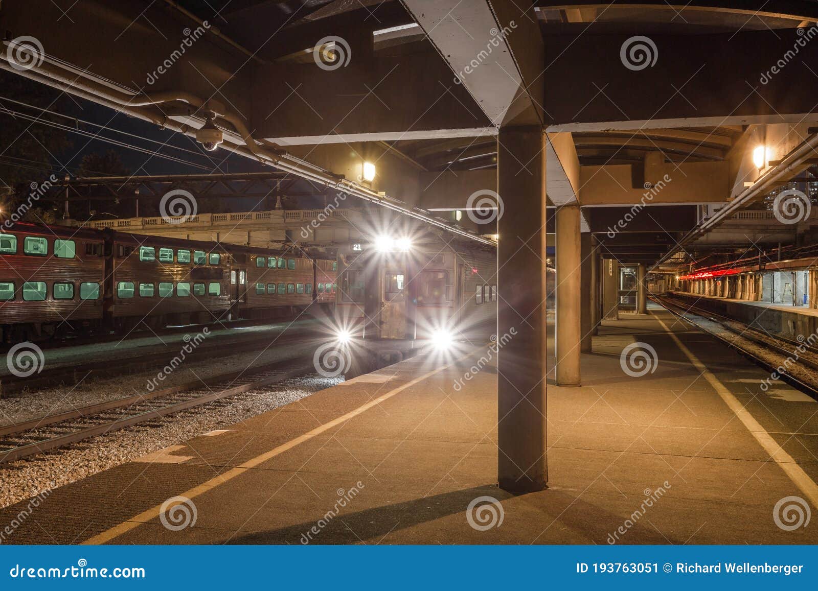 Train with Bright Headlights Letting Passengers Off at Platform Stock ...