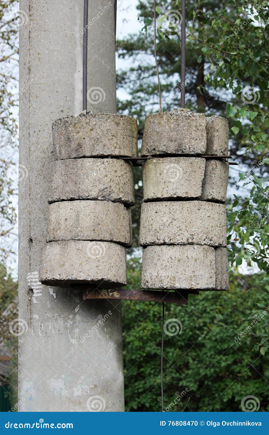 Train Cables With Concrete Counterweights On A Pole Near The Railroad ...