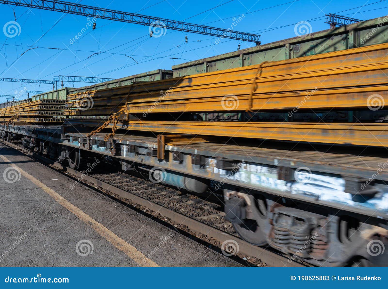 A Train Carrying Rails Arrives at the Station Stock Image - Image of ...