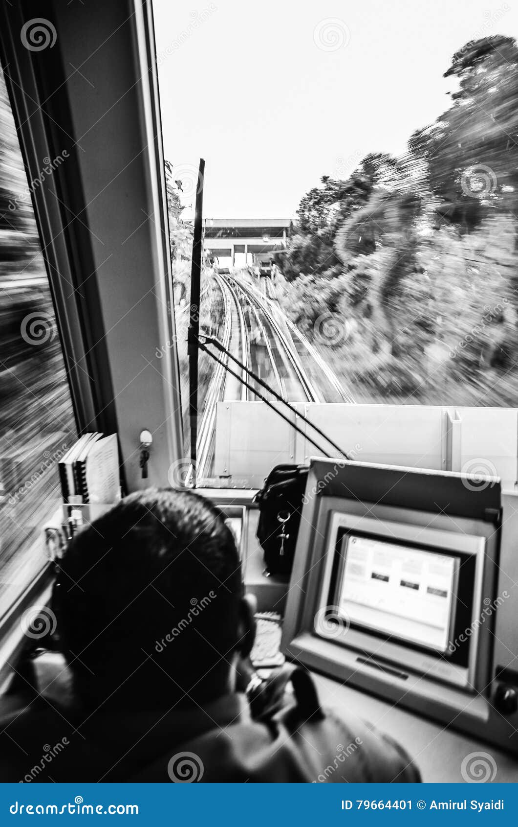 Train Driver Behind the Dashboard Controls in the Confined Space of the ...
