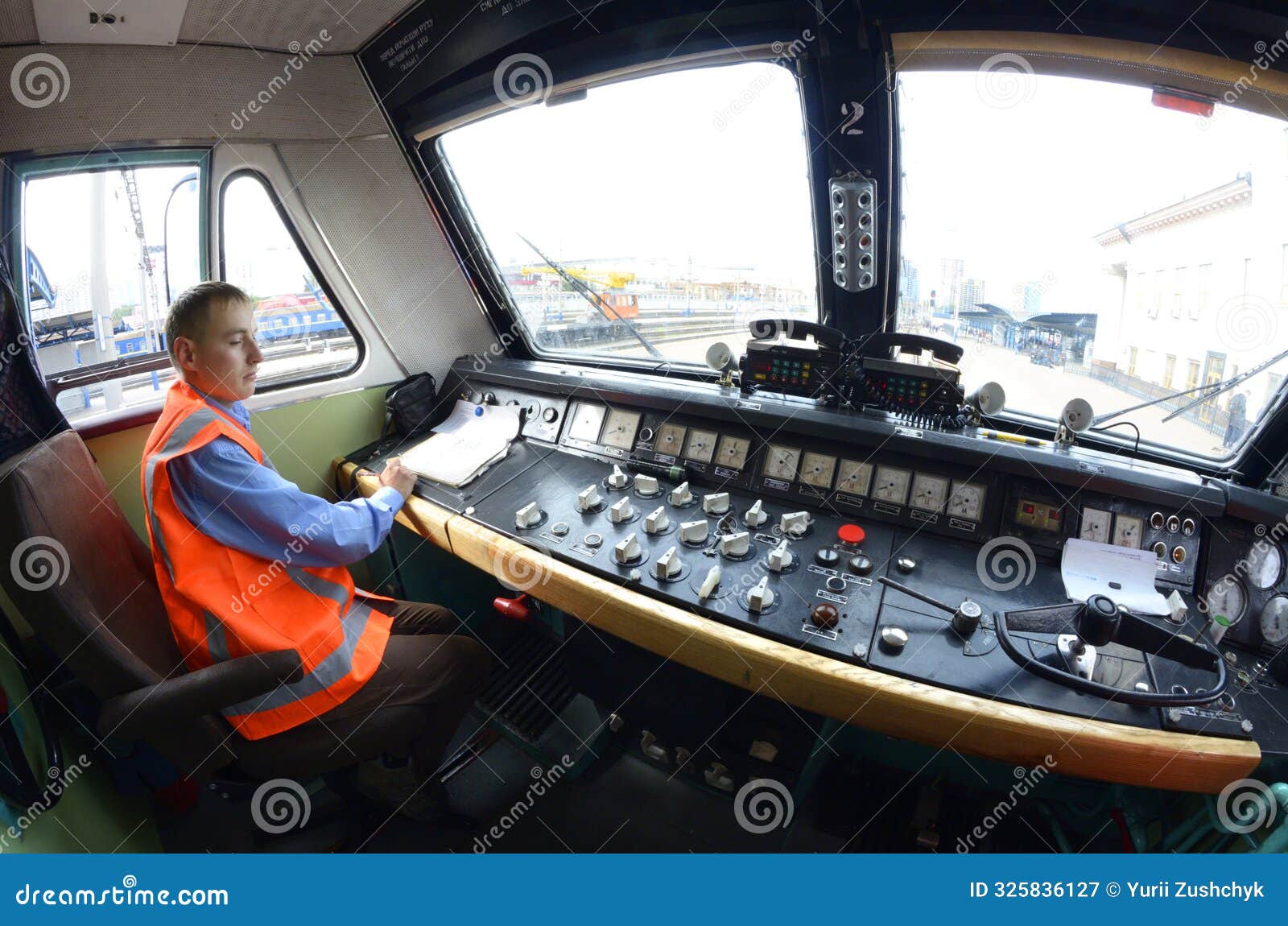 Train Driver Driving Passenger Train Sitting in the Cabin in Front of ...