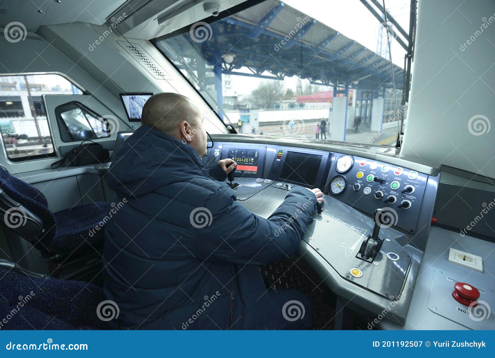 Train Driver Sitting in the Cabin of the Passenger Train in Front of ...