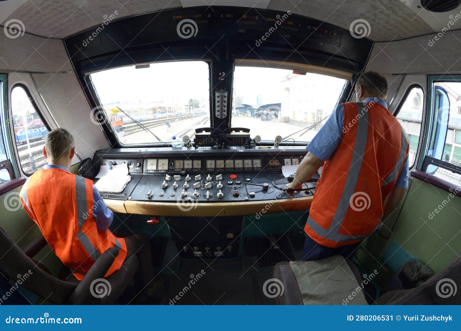 Train Drivers Driving Passenger Train Sitting in the Cabin in Front of ...